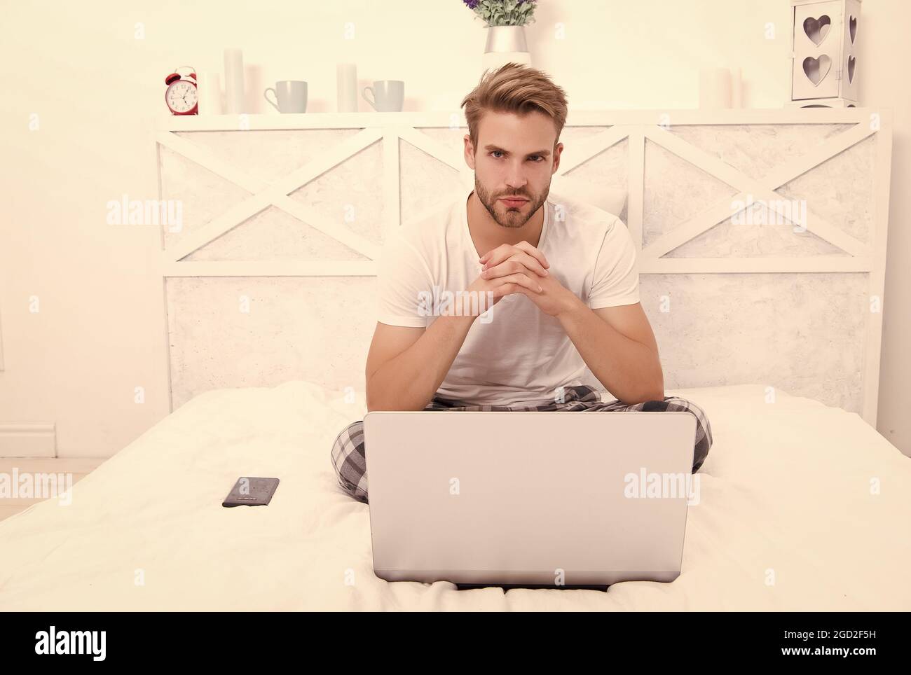 Handsome guy use computer digital technology for working from home ...