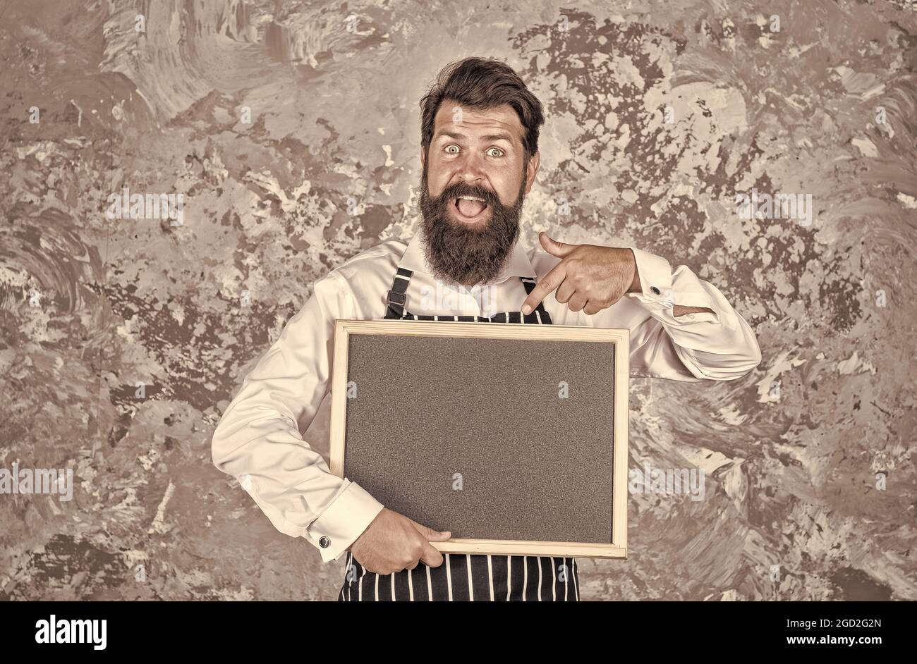 Man good looking hipster cafe barista with blackboard copy space, easy ...