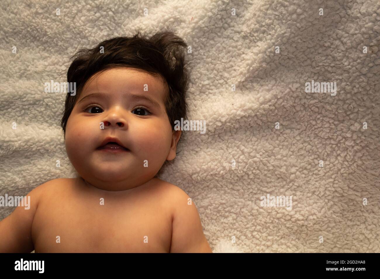 portrait of a hispanic newborn baby smiling and happy Stock Photo - Alamy