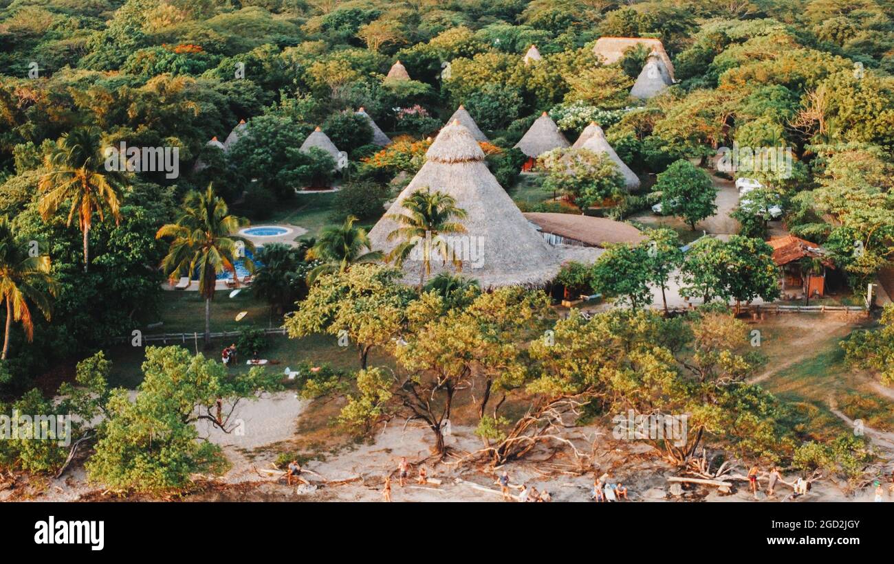 Aerial view of rest houses surrounded by tropical trees Stock Photo - Alamy