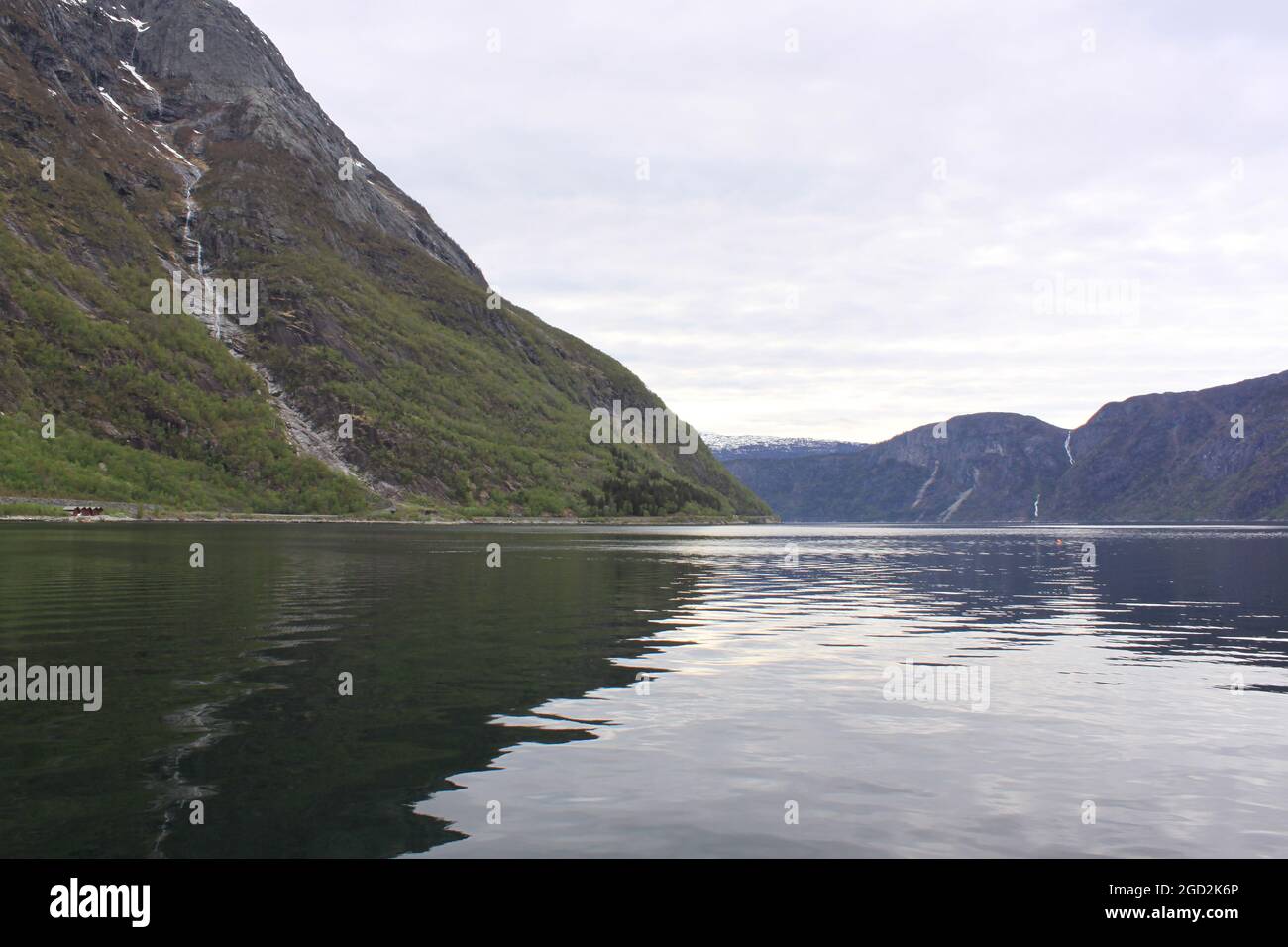 reflection of sky and mountains in the fjord - Eidfjord Stock Photo - Alamy