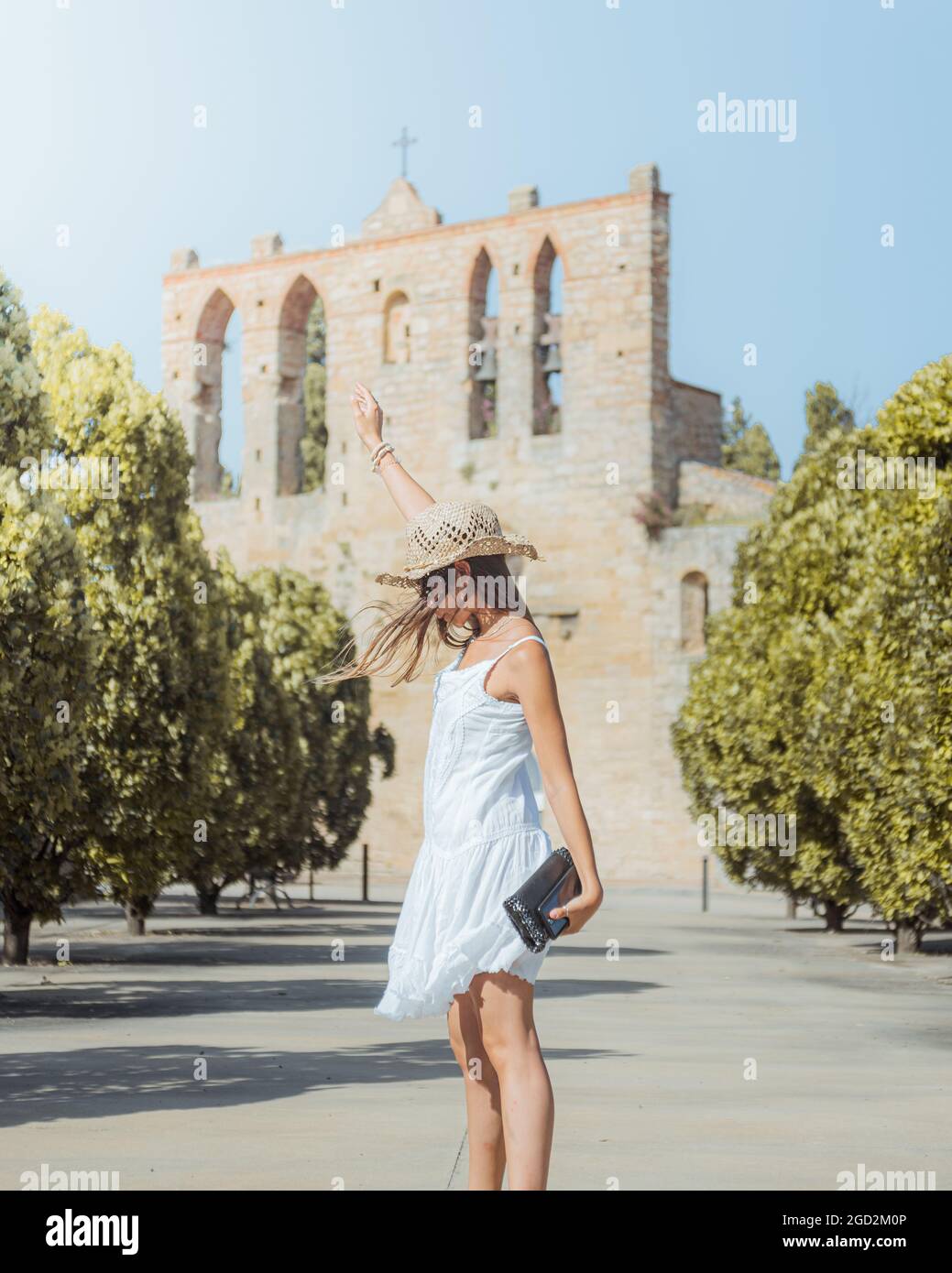 Lady posing with a a castle on the background in summer Stock Photo - Alamy
