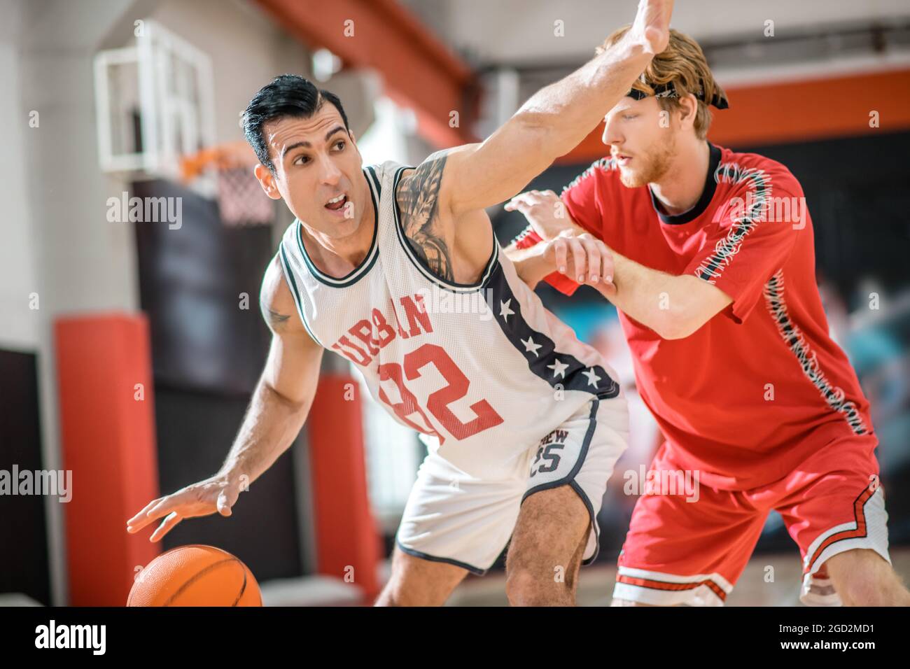 Two young men playing basketball and feeling excited Stock Photo - Alamy