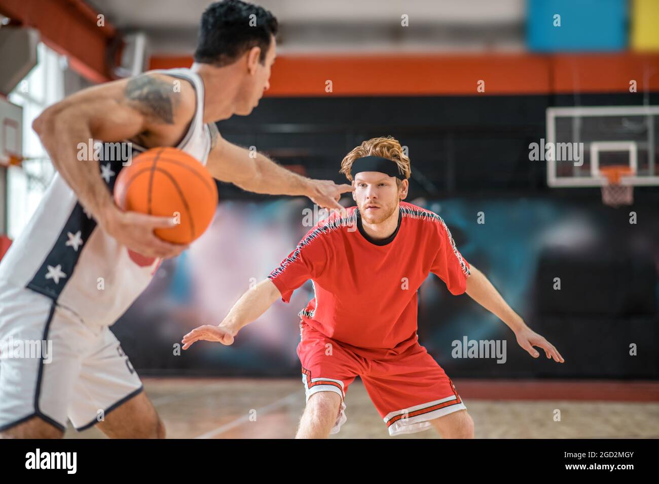 Two young men playing basketball and feeling excited Stock Photo - Alamy