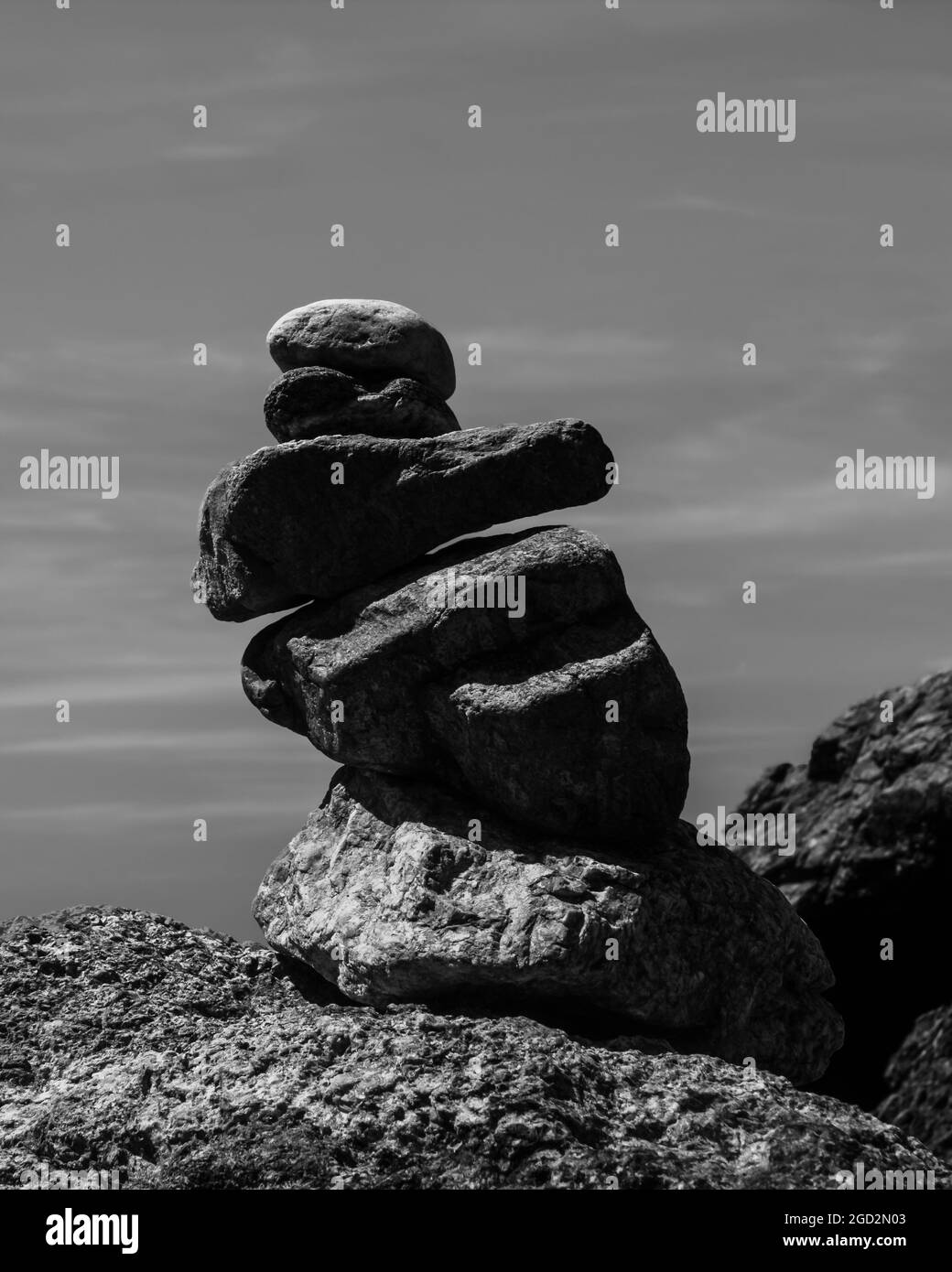 Rocks of different sizes, shapes and colors on top of each other on the ...