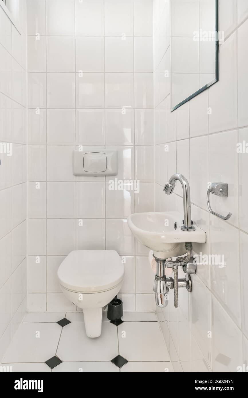 Interior of small clean washroom in miniature style Stock Photo - Alamy