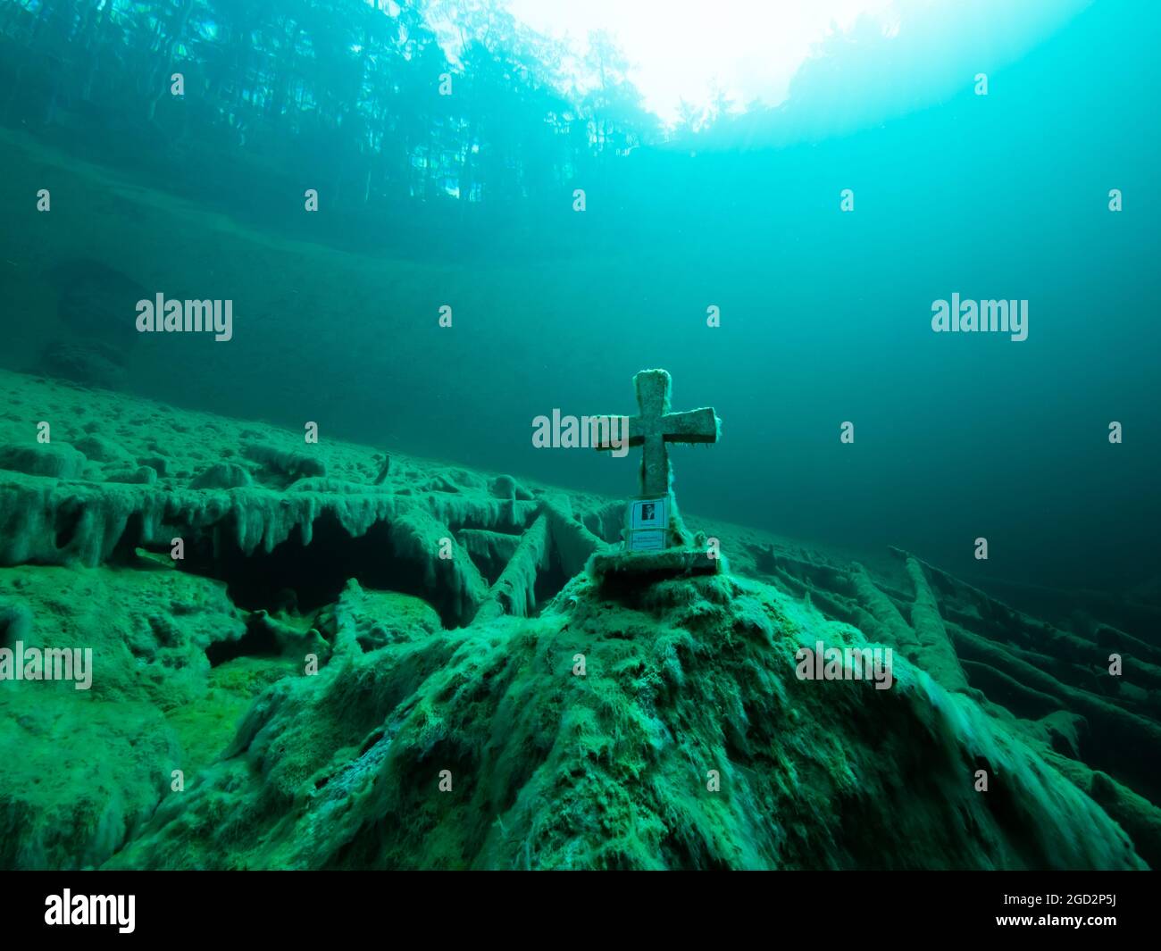 Stone cross underwater in a mountain lake, Good visibility, clear water ...