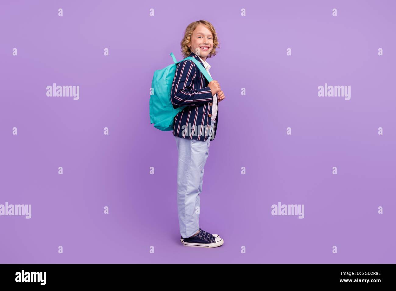Full length body profile side size view of attractive cheerful boy ...