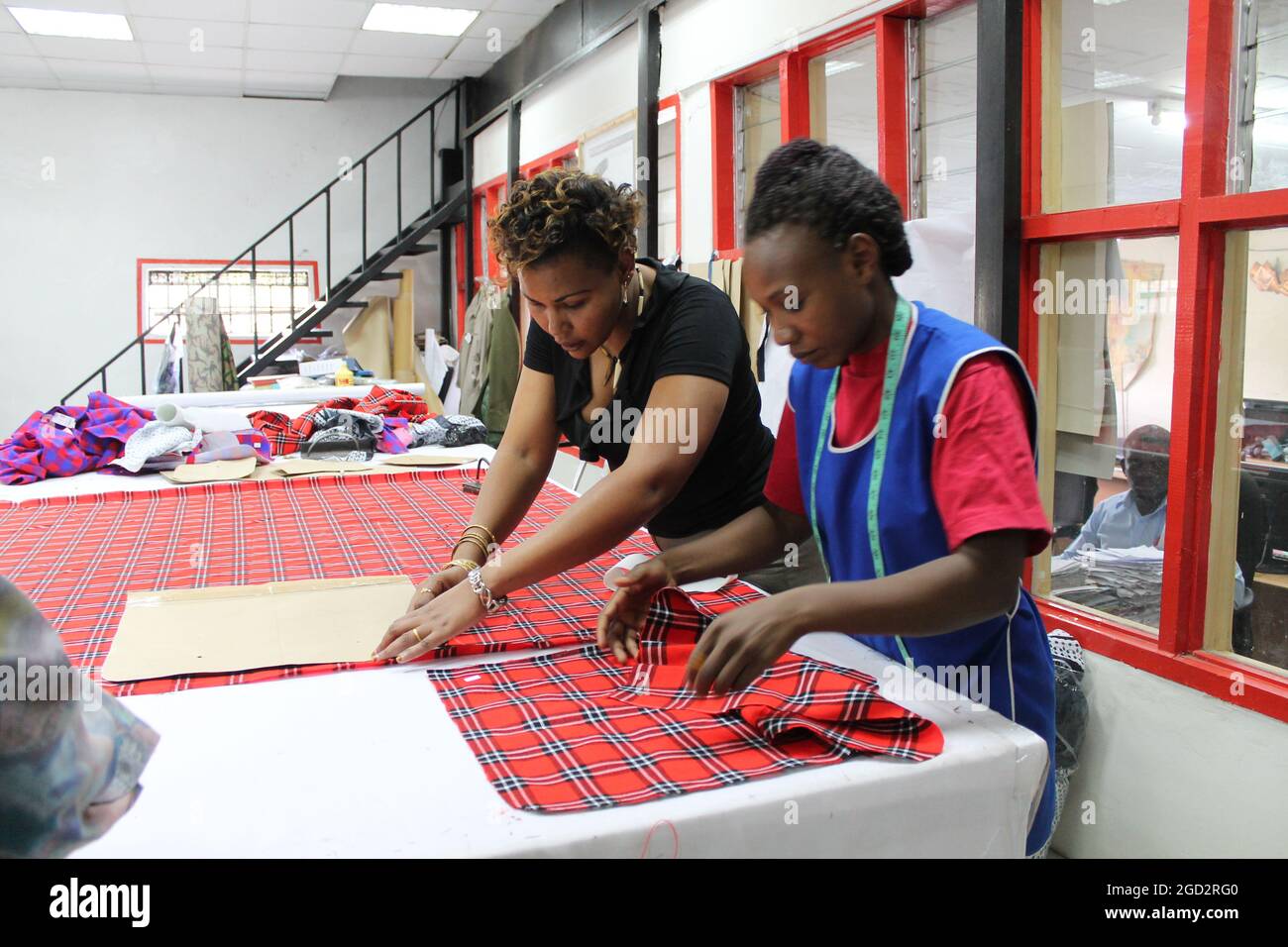Masai fabrics are hand cut in preparation for custom made Doreen ...