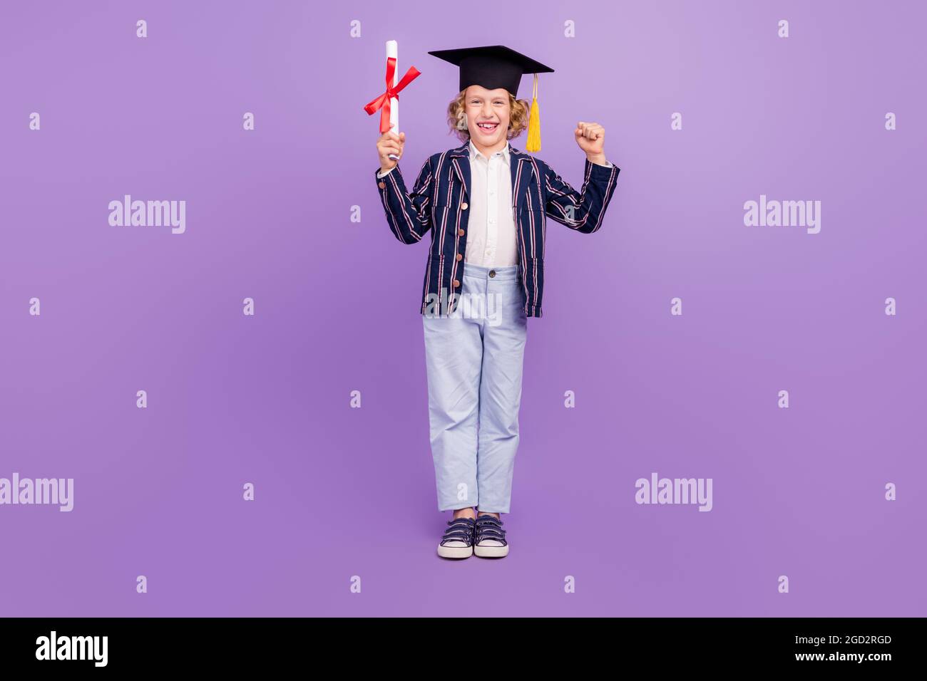Full length body size view of attractive cheerful schoolboy holding ...