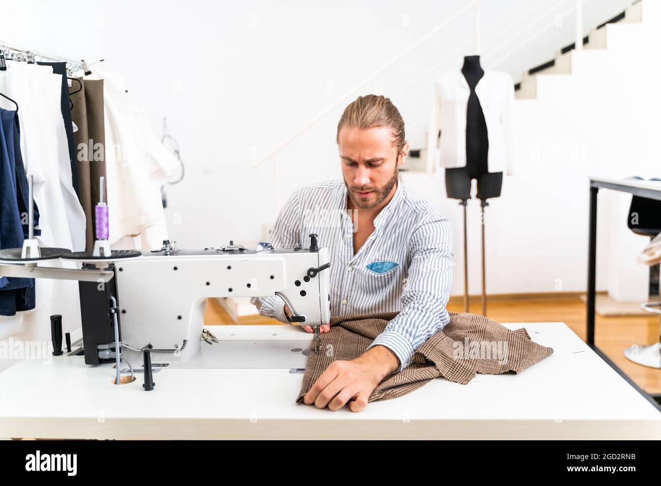 Clothing stylist creating a new design for a dress - Fashion designer ...