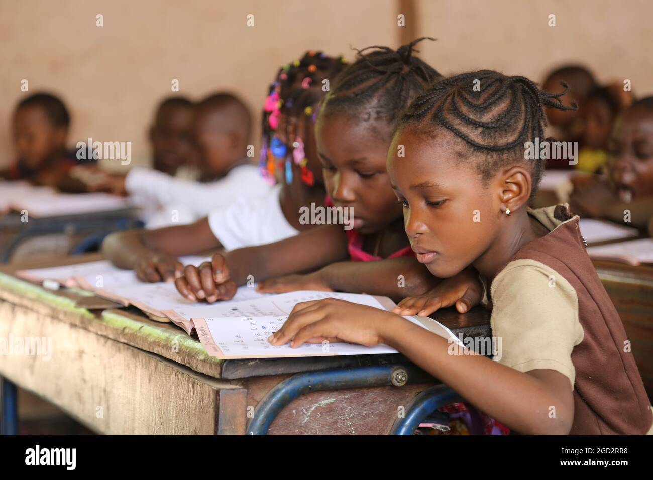 Young school students during a reading class at Darsalam School in ...