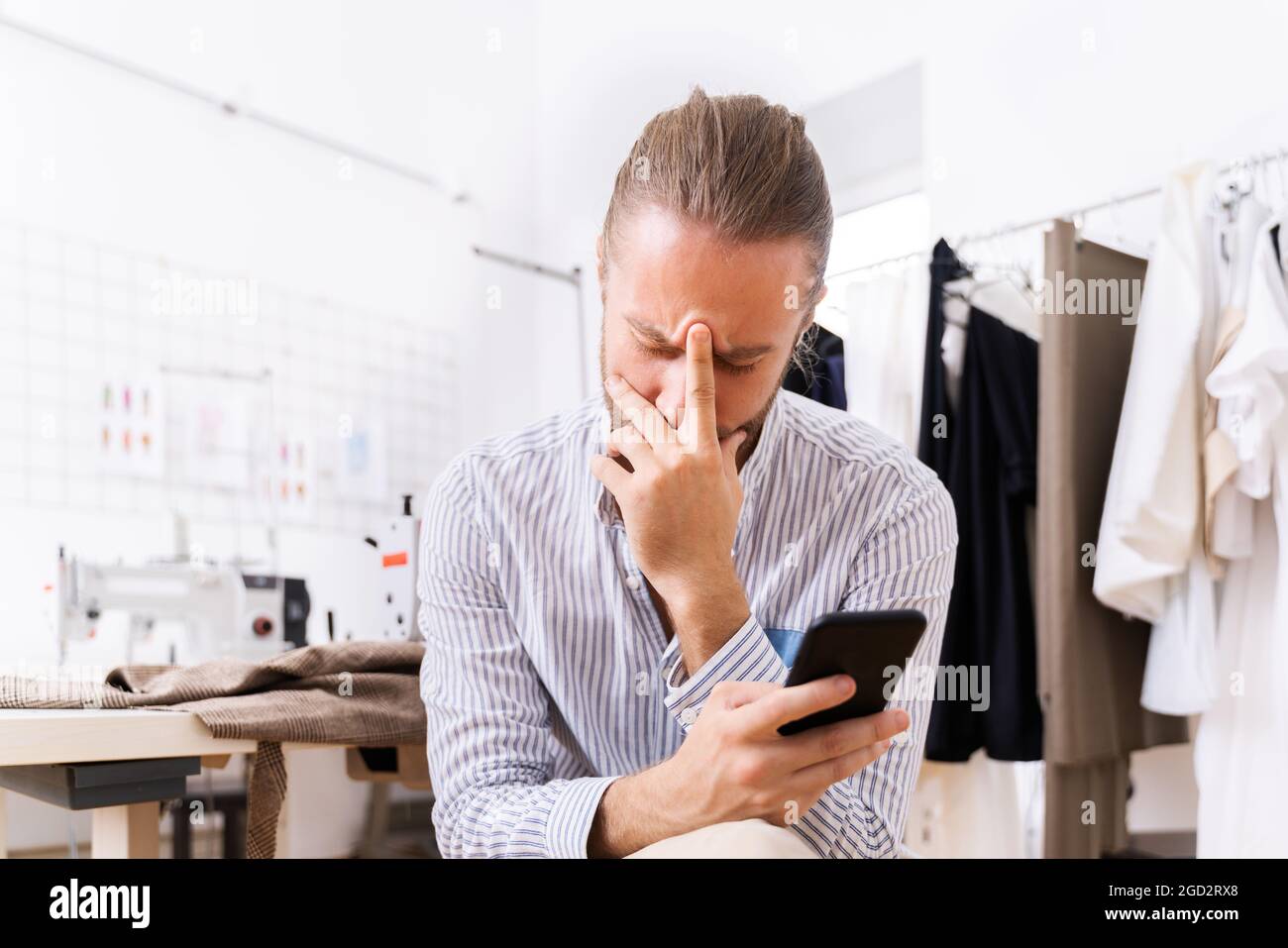 Clothing stylist creating a new design for a dress - Fashion designer ...