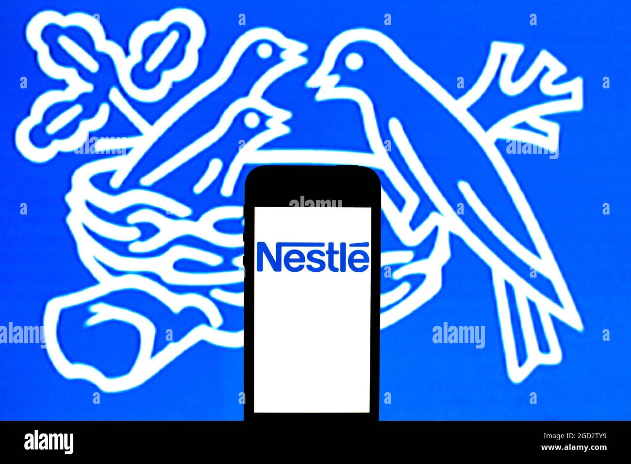 In this photo illustration, a Nestle S.A. logo seen displayed on a ...