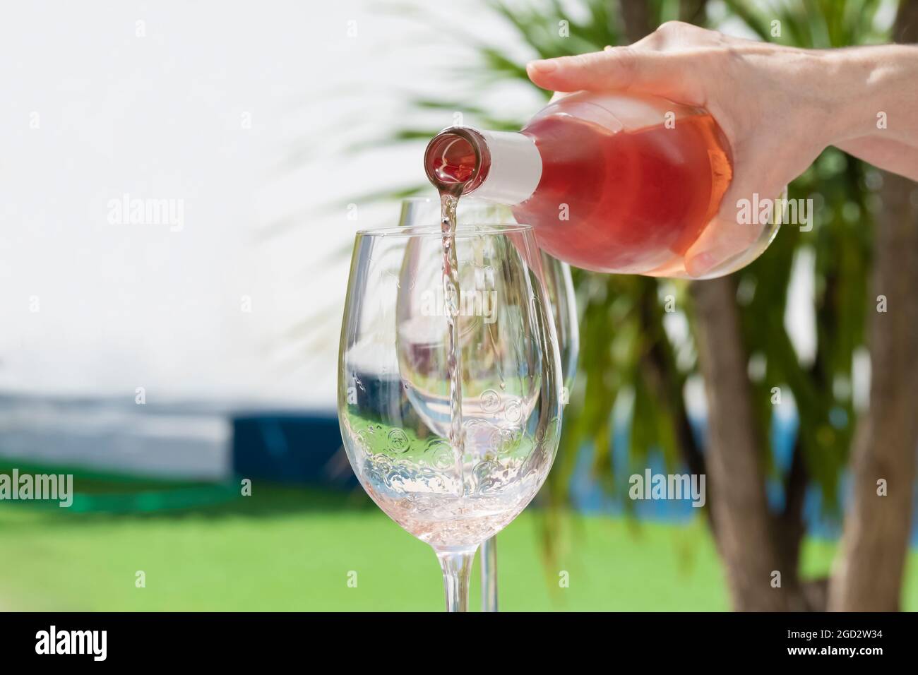 Hand pouring wine couple hi-res stock photography and images - Alamy