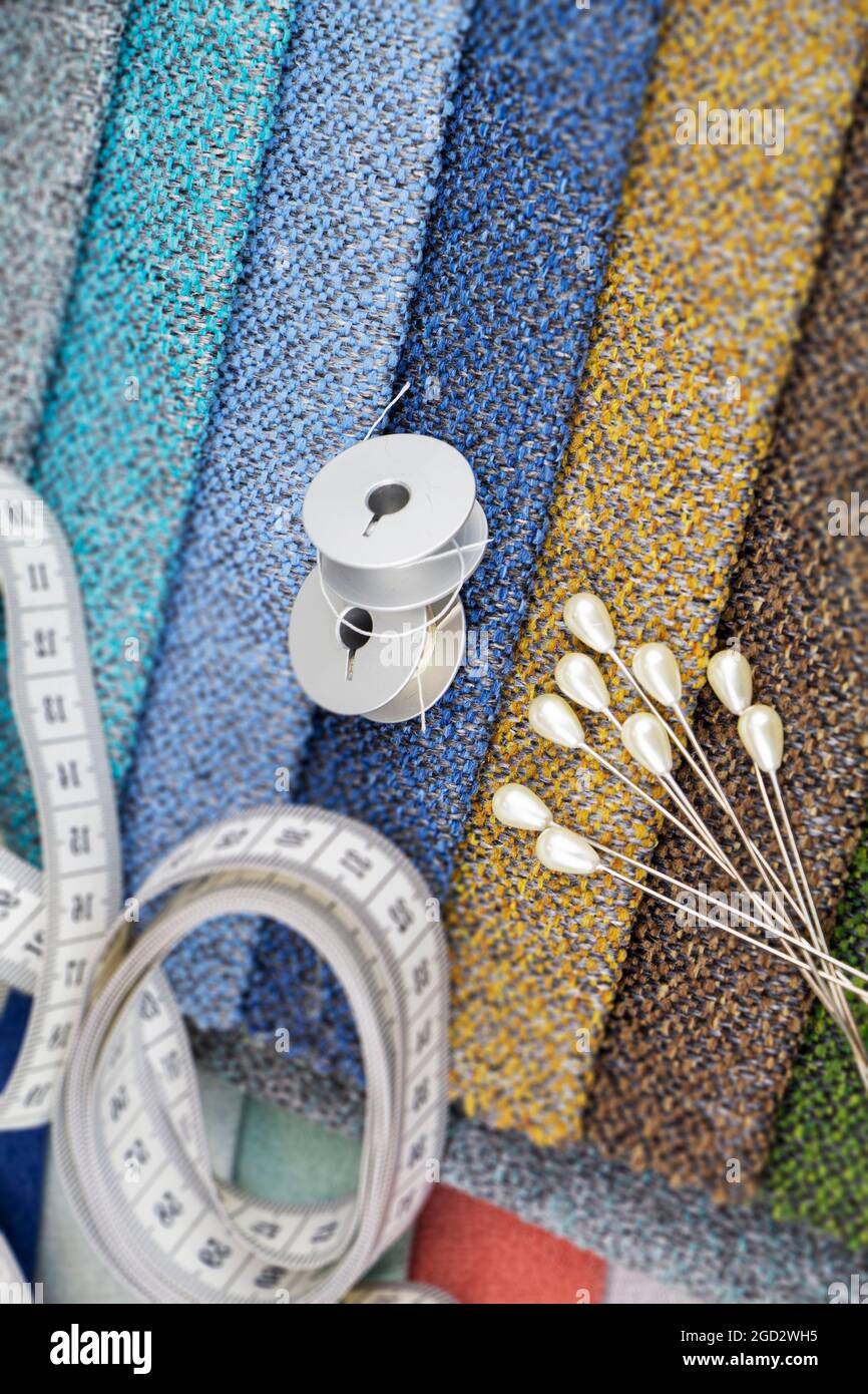 Pieces of fabric and thread. Tailoring, production of clothing and ...