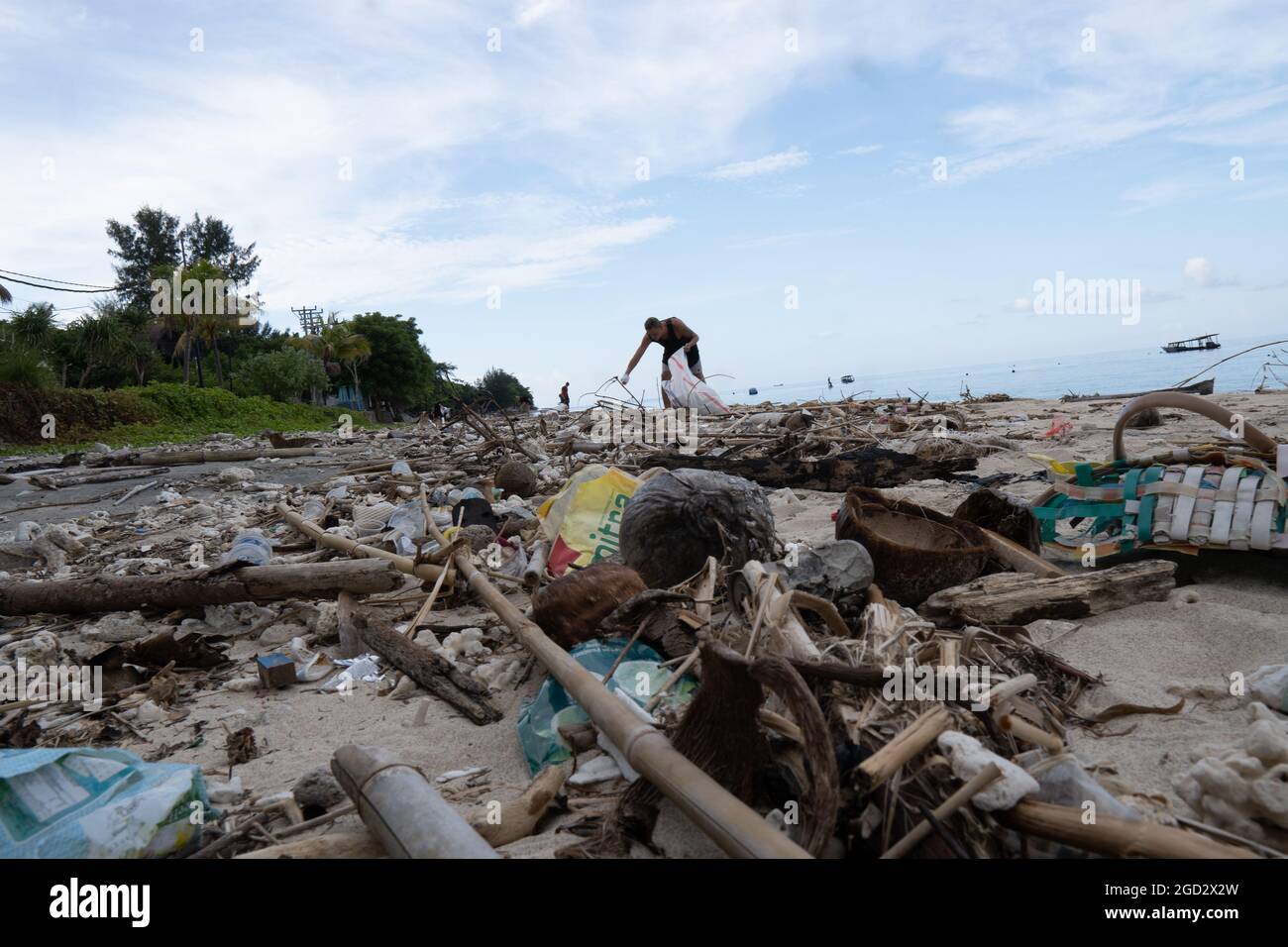 Man cleaning the environment after the disaster Stock Photo - Alamy
