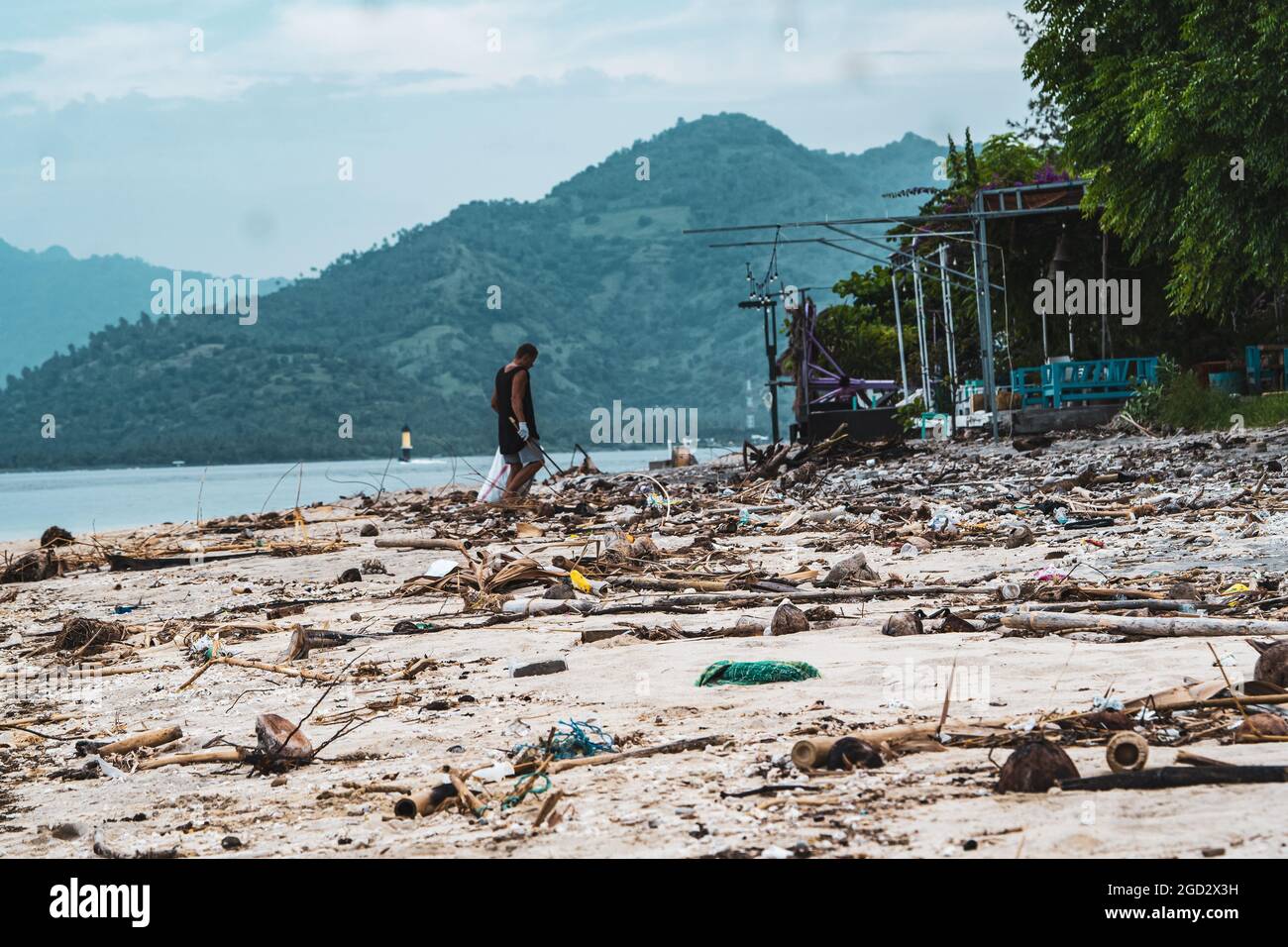 Man cleaning the environment after the disaster Stock Photo - Alamy