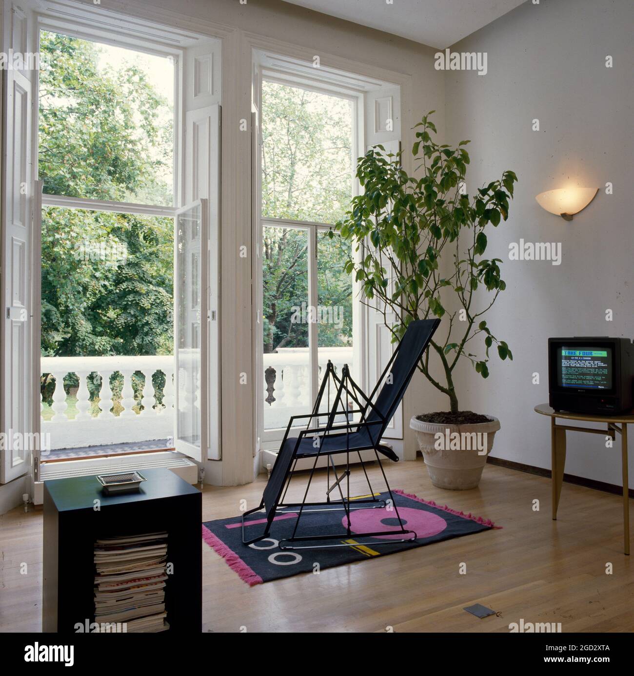 French windows open onto garden hi-res stock photography and images - Alamy