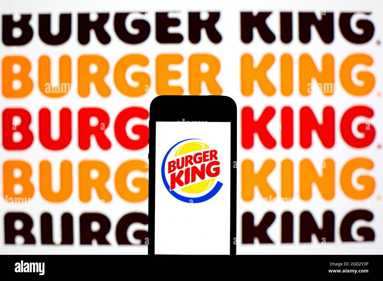 In this photo illustration, a Burger King logo seen displayed on a ...