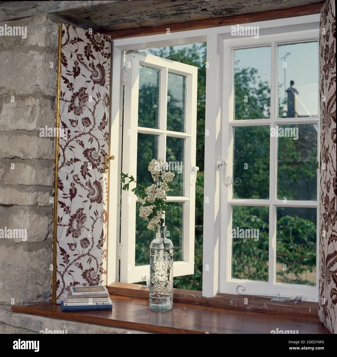 Closeup of open window with fabric covered shutters Stock Photo - Alamy