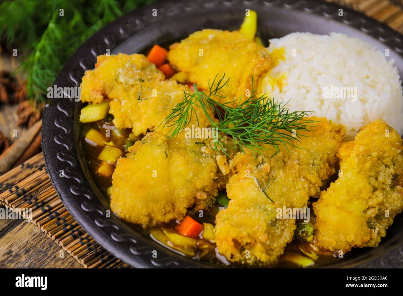 Fried fish in Chinese sauce with rice Stock Photo - Alamy