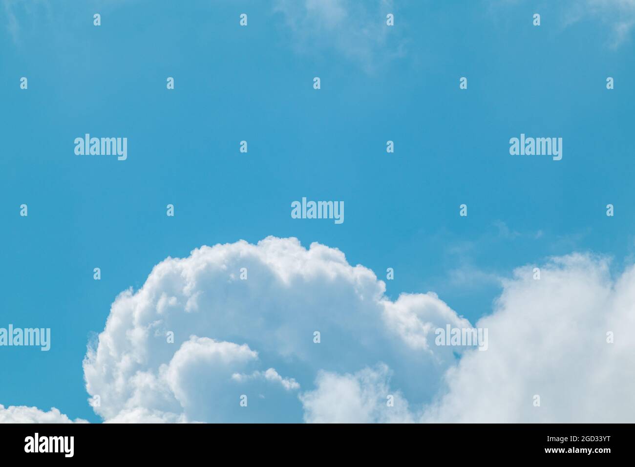Fluffy white high clouds framing bright blue sky, cloudscape background ...