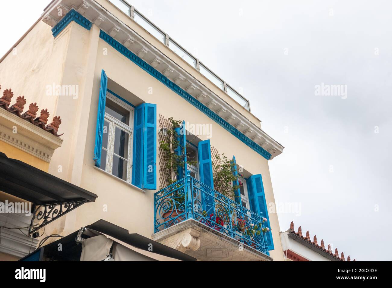 Traditional Greek house exterior with white walls, nice cozy blue ...