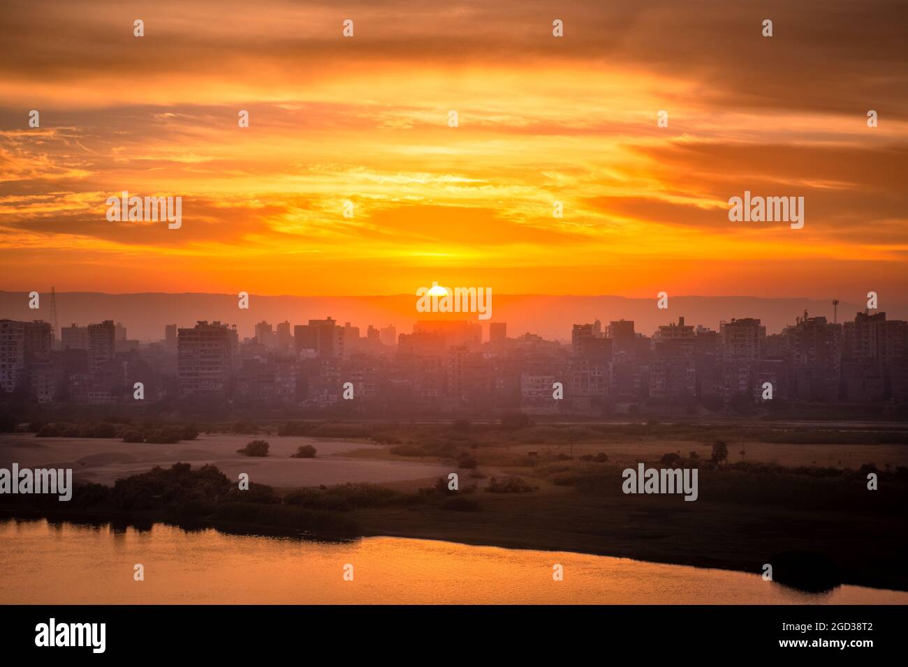 Sunset scene from Sohag city in south Egypt in a cloudy colorful ...
