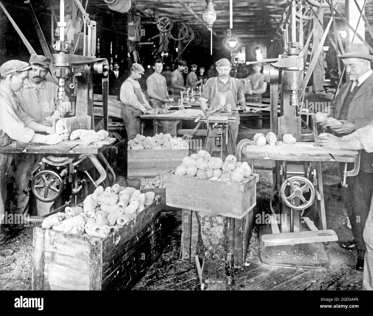 Workers manufacturing dolls made from bass wood ca. between 1909 and ...