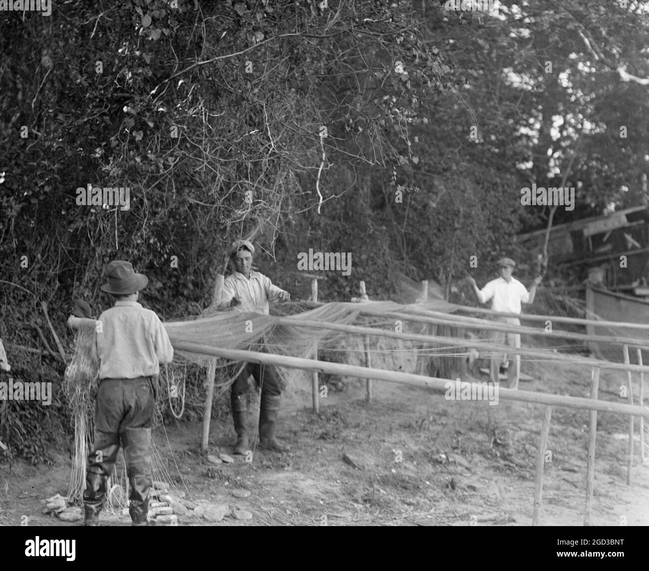 Early 1900s men fishing hi-res stock photography and images - Alamy