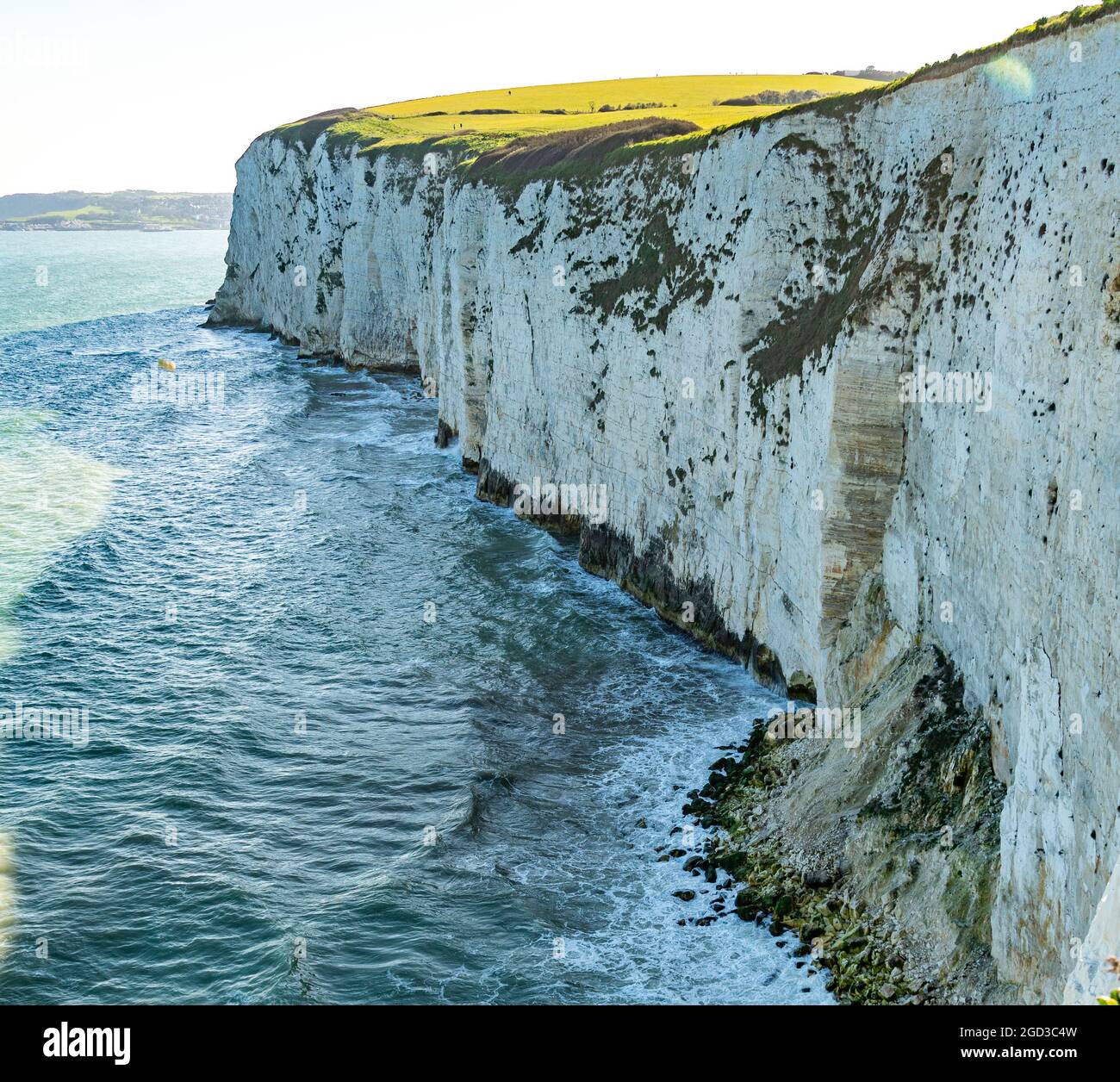 Beautiful view of chalk cliffs with vibrant grass covering them at the ...