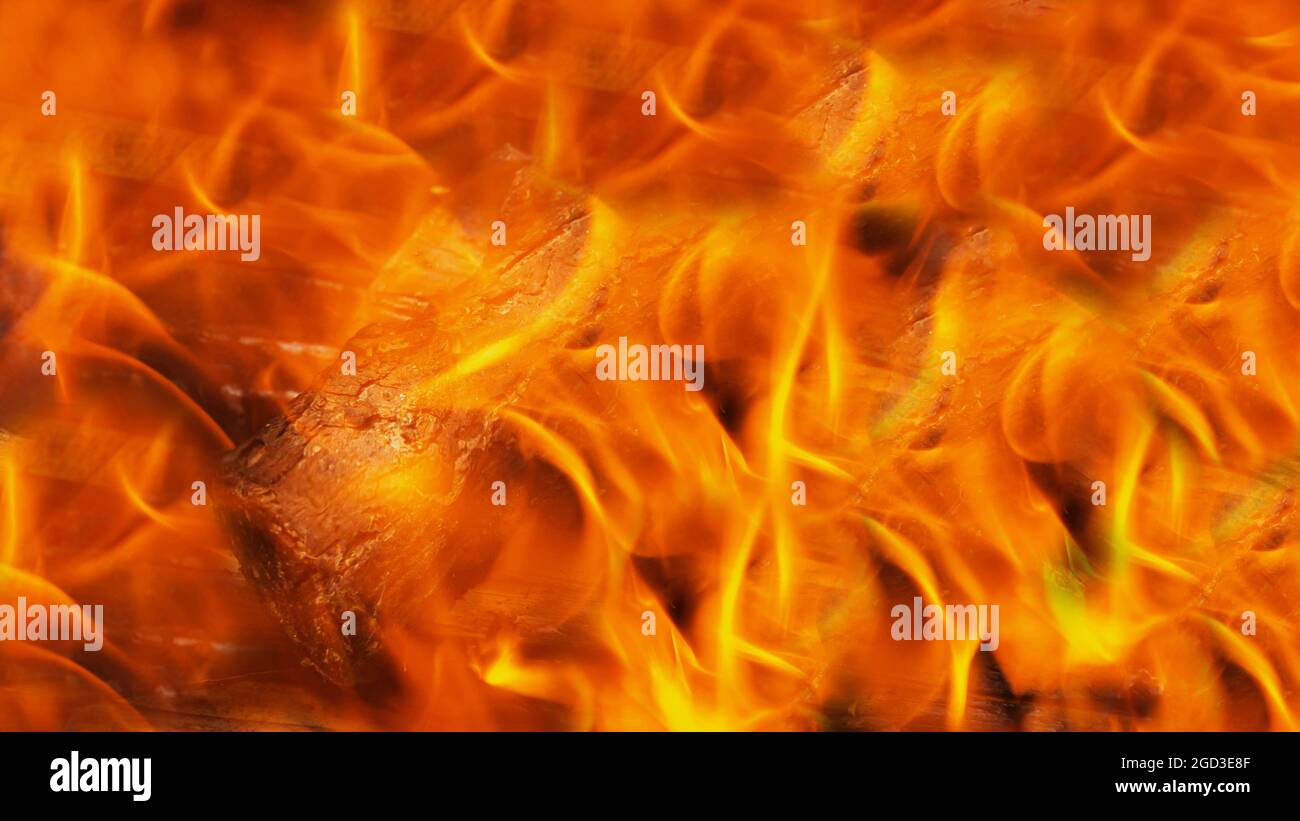 Beautiful orange fire, flame of fire on wood, fireplace fiery close-up ...