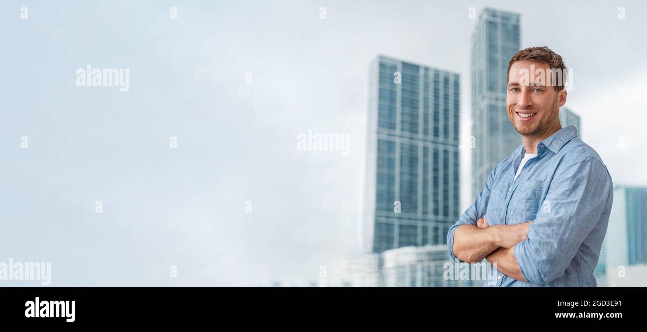 Smiling business man portrait in city background. Confident young ...
