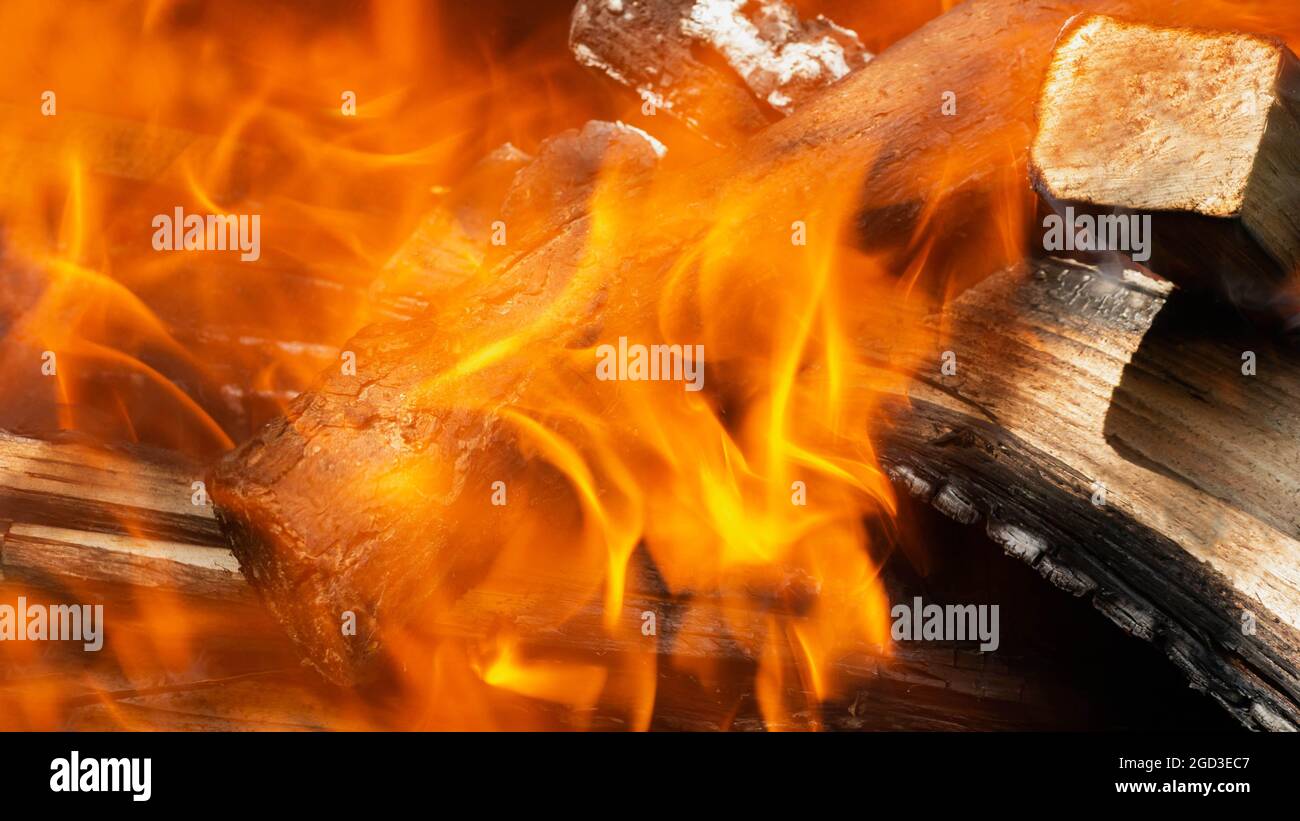 Beautiful orange fire, flame of fire on wood, fireplace fiery close-up ...