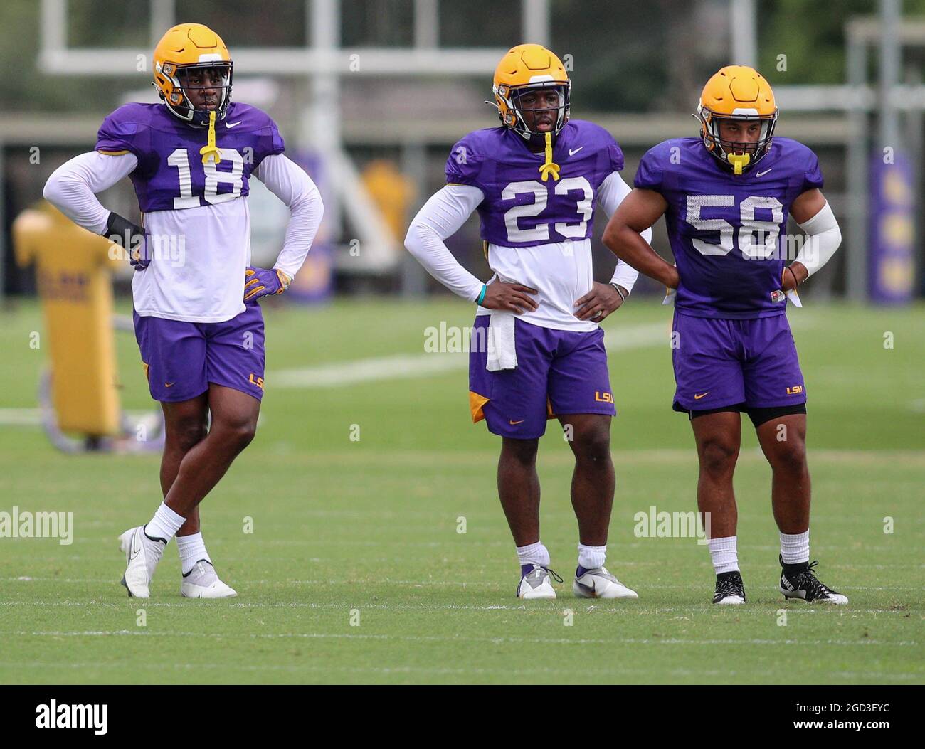 August 10, 2021: LSU linebackers Damone Clark (18), Micah Baskerville ...