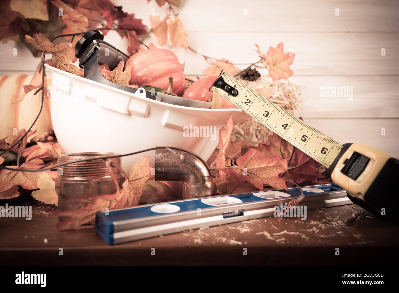 Happy Thanksgiving with construction tools, maple leaves and pumpkin on ...