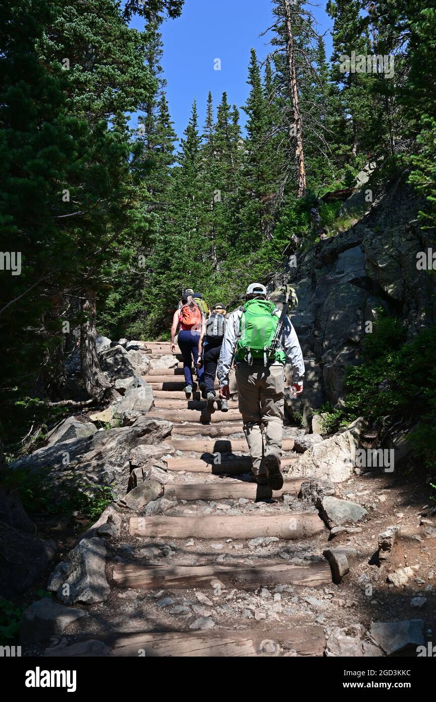 Young hikers ascend Emerald Lake Trail in Rocky Mountain National Park ...