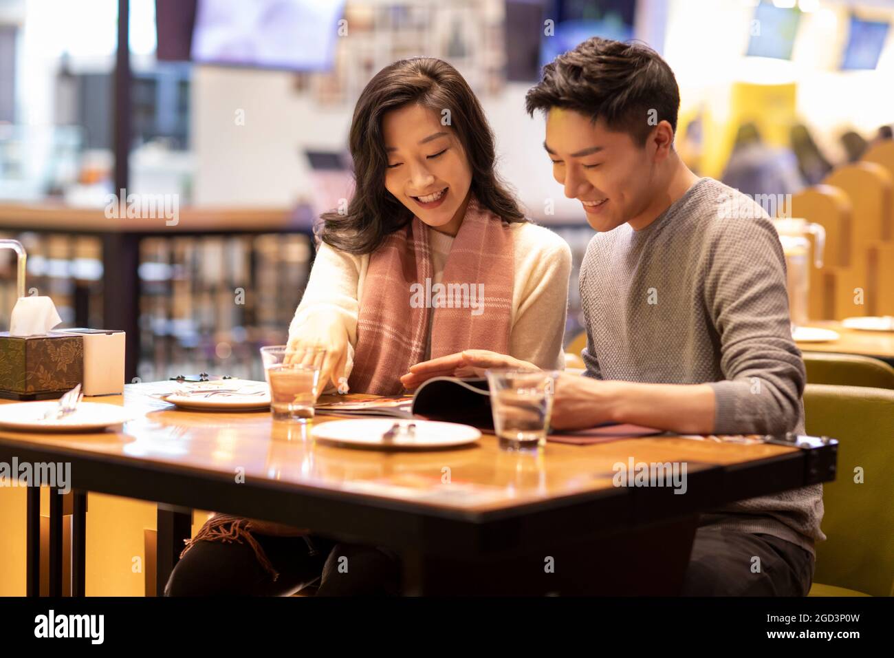 Couple ordering food in restaurant hi-res stock photography and images ...