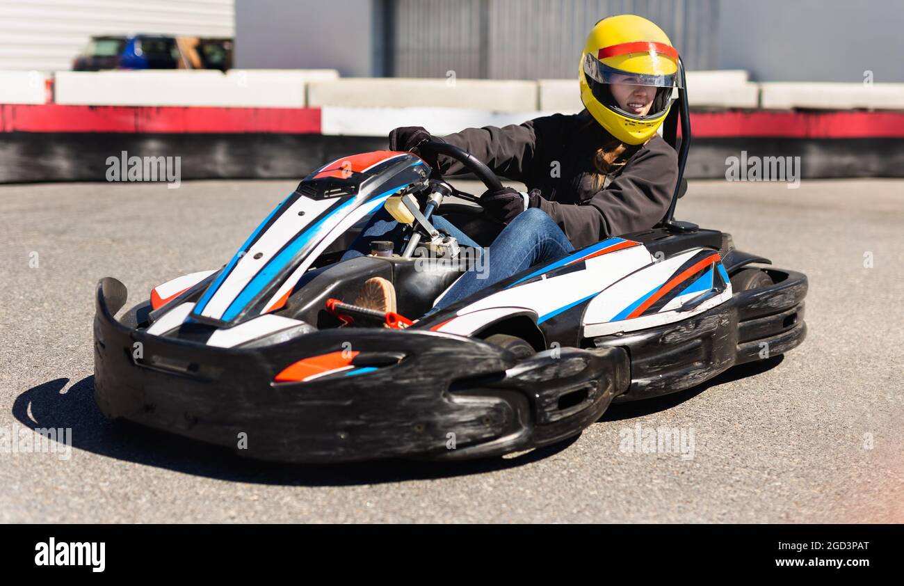 Girl driving kart at racing track outdoors Stock Photo - Alamy