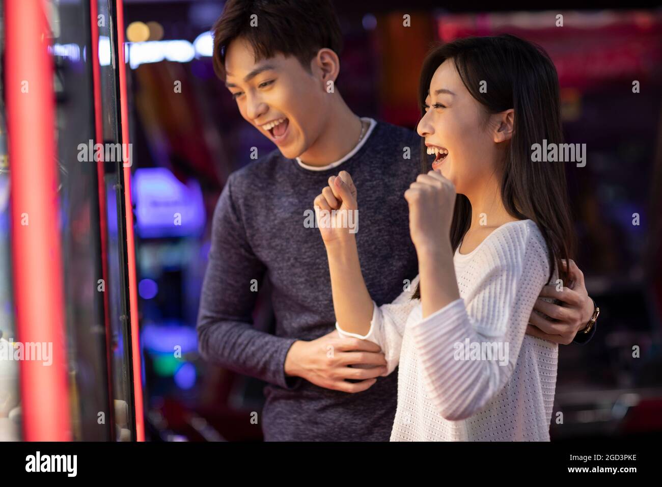 Couple standing in arcade hi-res stock photography and images - Alamy