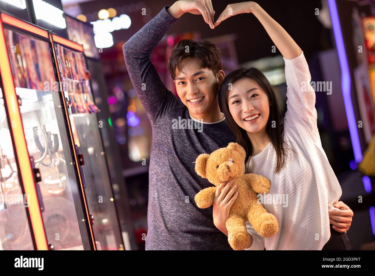 Couple standing in arcade hi-res stock photography and images - Alamy