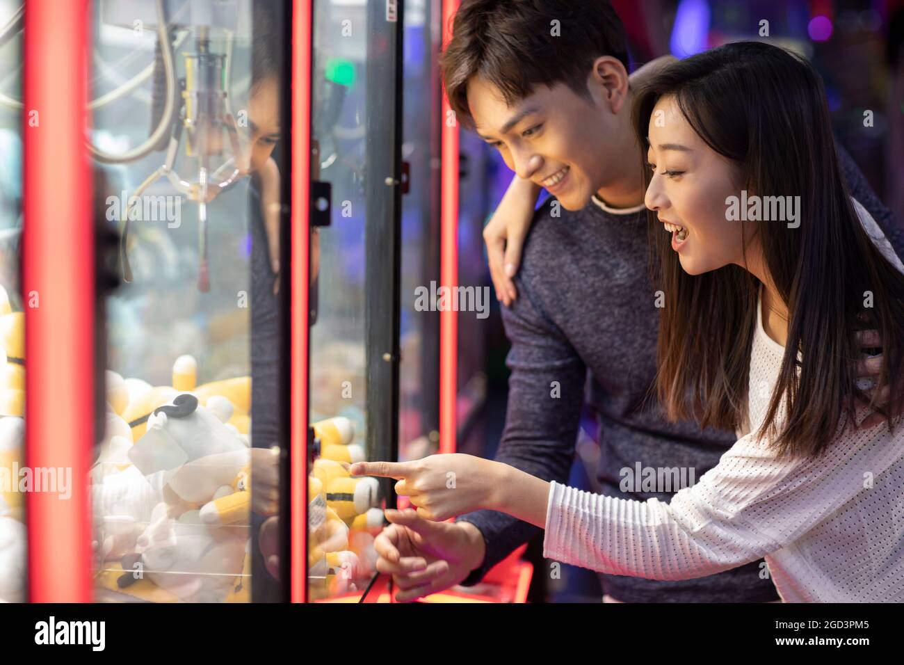 Couple standing in arcade hi-res stock photography and images - Alamy