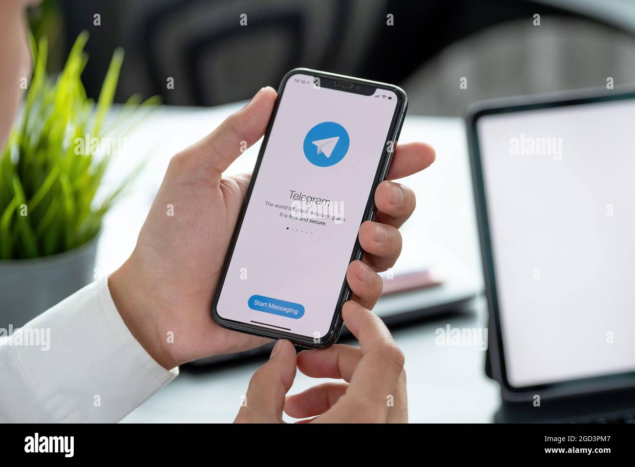 CHIANG MAI, THAILAND, APR 06, 2021 : Man hand holding iPhone X with ...