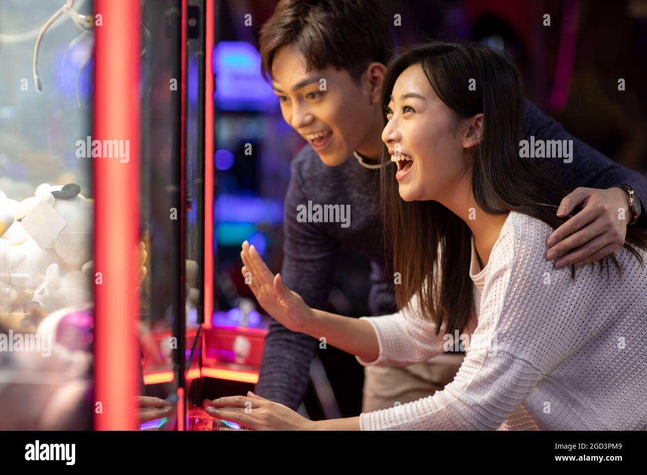 Couple standing in arcade hi-res stock photography and images - Alamy