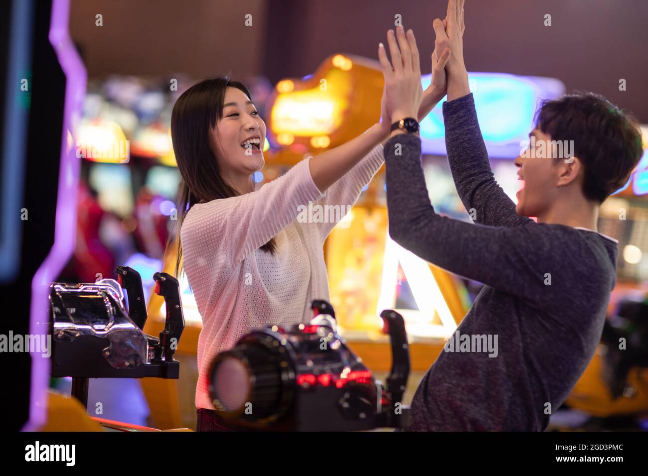 Couple standing in arcade hi-res stock photography and images - Alamy