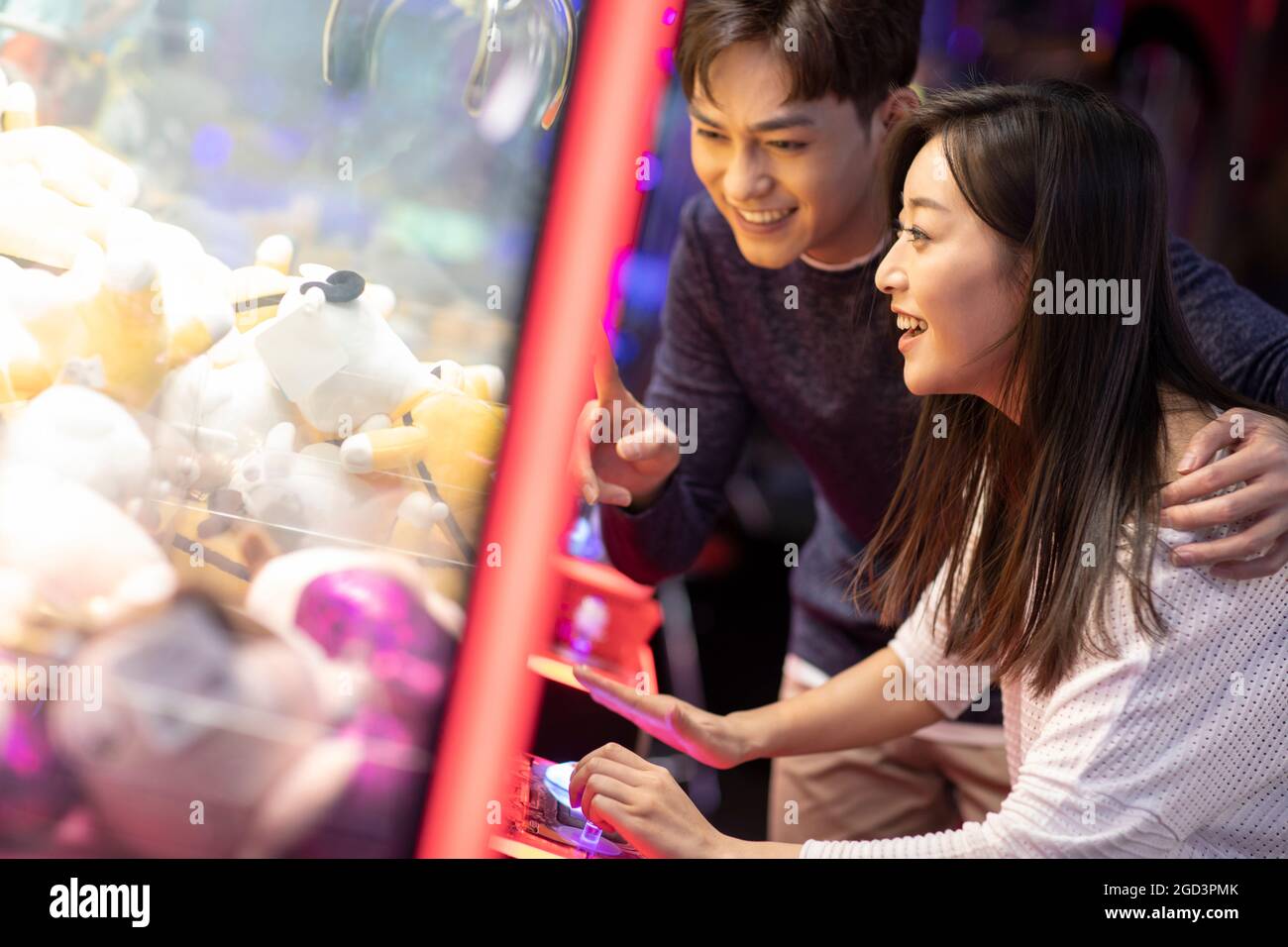 Couple standing in arcade hi-res stock photography and images - Alamy