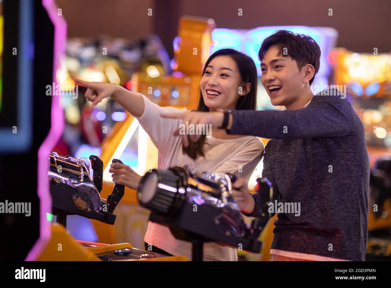 Couple standing in arcade hi-res stock photography and images - Alamy