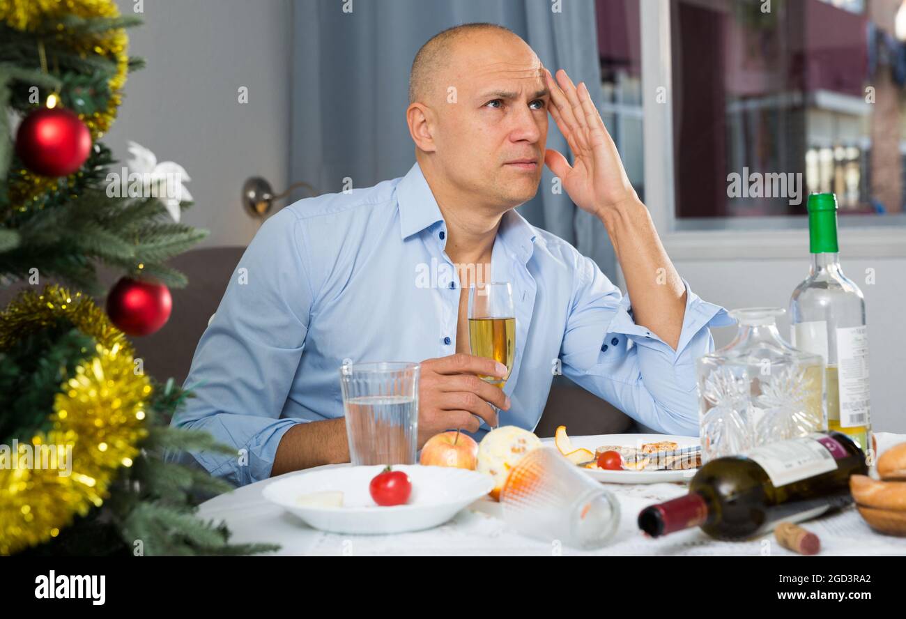 Sad man sit table alone hi-res stock photography and images - Alamy
