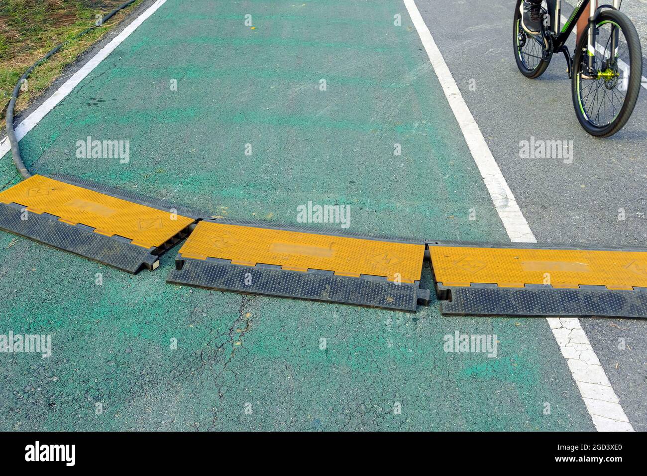 Black and yellow heavy plastic covers for people and vehicle to cross ...